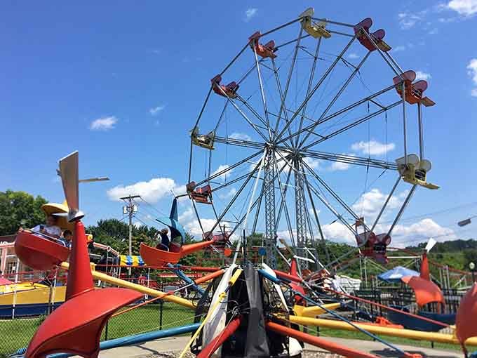 The colorful chaos of classic amusement park rides proves that happiness doesn't require a billion-dollar budget.