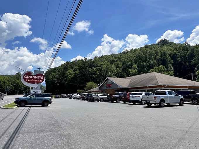 That red script sign against mountain greenery isn't just marking a restaurant&mdash;it's announcing a Southern food sanctuary.