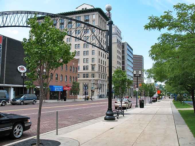 Tree-lined streets meet historic architecture where affordability and character shake hands like old friends reuniting.
