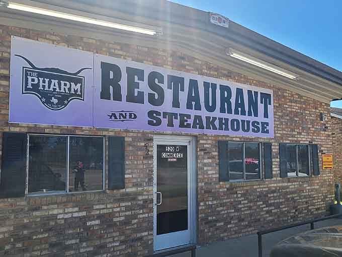That brick facade and bold signage announce serious steakhouse business in the heart of small-town Texas.