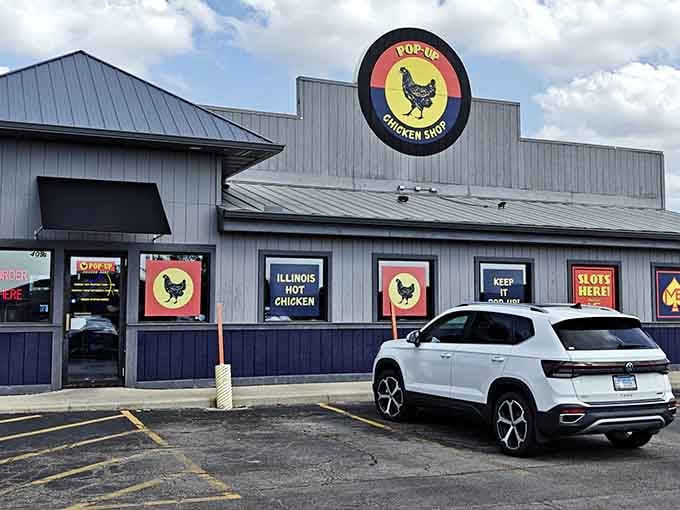 The colorful window signs practically shout "Illinois Hot Chicken," and honestly, who could resist that kind of enthusiastic invitation?