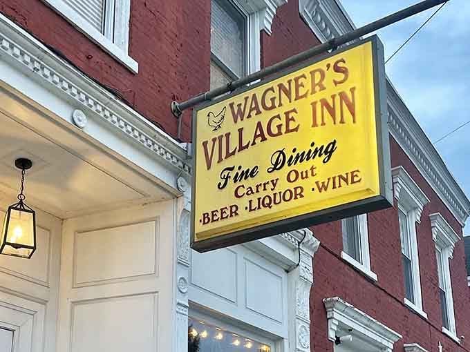 That yellow sign isn't just pointing you toward dinner; it's pointing you toward some of the finest fried chicken in the entire state.