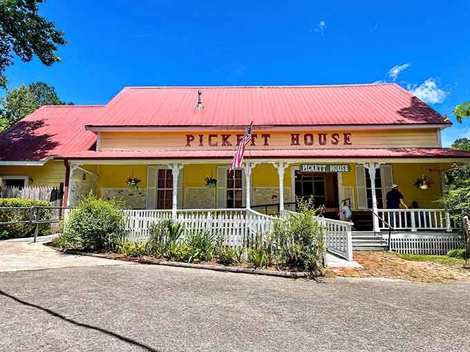 That cheerful yellow exterior with the red roof isn't just charming, it's your beacon to fried chicken paradise.