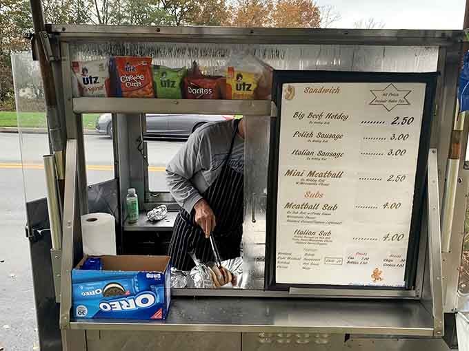 The serving window where magic happens, one perfectly wrapped hot dog at a time, no reservations required.