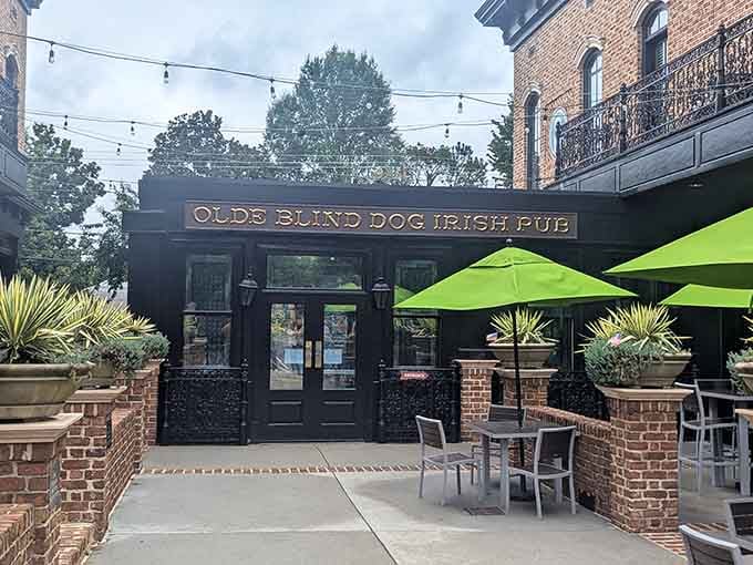 The outdoor seating with those bright green umbrellas proves Irish hospitality extends beyond the front door.