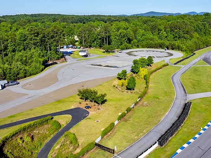 The sweeping mountain backdrop frames this motorsports paradise where elevation changes create an unforgettable racing experience.