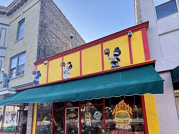 Those vintage characters standing guard above the entrance aren't just decoration, they're your first clue something special awaits inside.