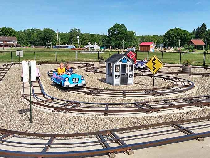 Little engineers navigate their own miniature highway, complete with traffic signs and zero actual traffic jams.