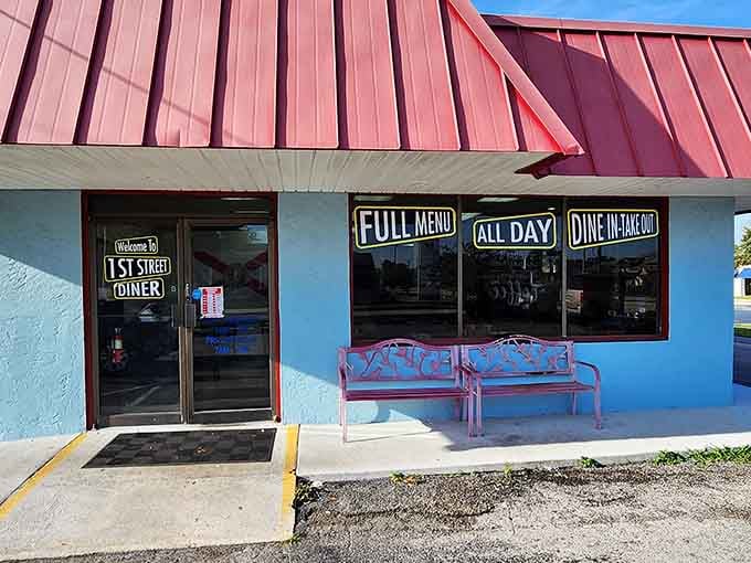 That cheerful blue exterior with the red-striped awning is your beacon to breakfast bliss in Winter Haven.