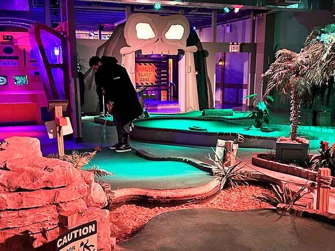 That giant skull entrance looms overhead while tropical props and dramatic lighting turn mini golf into a proper swashbuckling adventure.