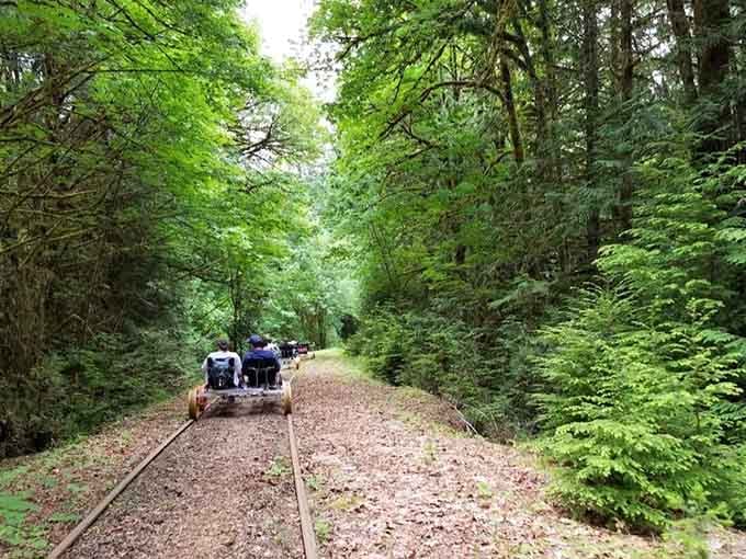 There's something wonderfully surreal about pedaling through the forest on actual railroad tracks with friends.