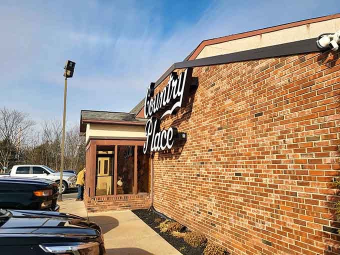 That barn-style exterior isn't fooling anyone—this is where serious eating happens, and the full parking lot proves it.