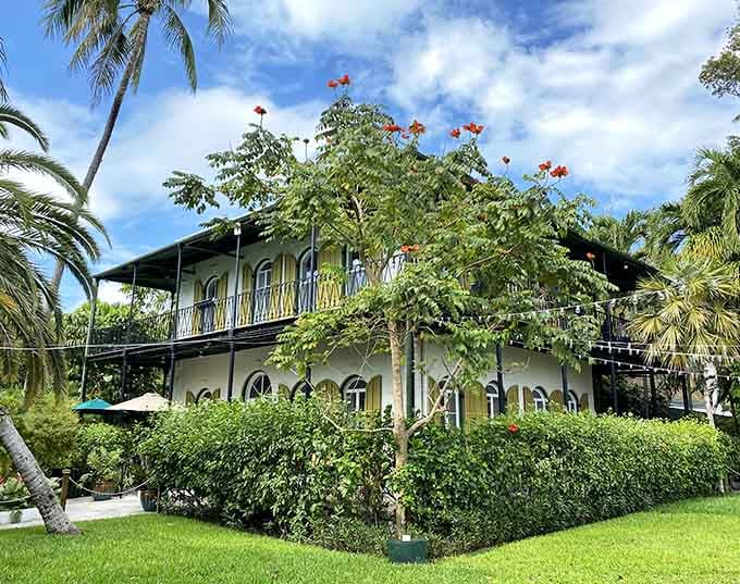 Lush gardens frame Hemingway's former paradise, where creativity bloomed alongside the tropical flora and feline friends.