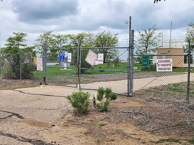 The chain-link fencing and warning signs remind visitors this isn't your typical Colorado park, but a genuine piece of history.