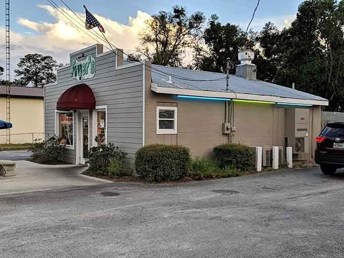 That unassuming gray building with the burgundy awning is where fried chicken dreams come true in Melrose.