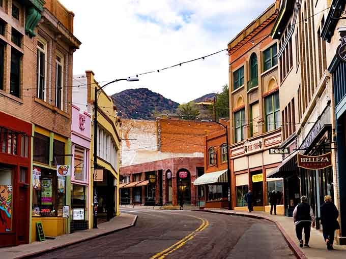 Main Street curves through the canyon like a time capsule, with mountains standing guard over this quirky desert gem.