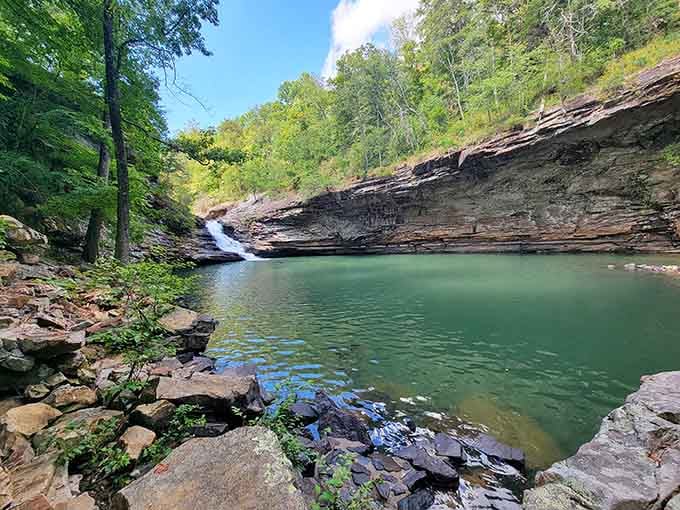 That emerald pool at the base looks like Mother Nature's own private swimming hole, minus the admission fee.