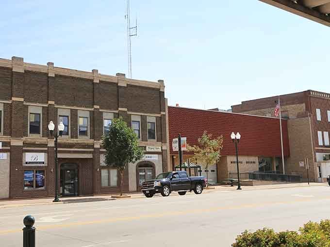 Classic brick storefronts line quiet streets where your wallet can finally exhale and stop hyperventilating.