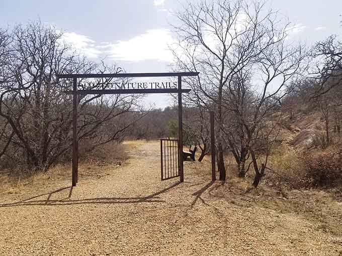 That rustic metal archway isn't just an entrance&mdash;it's a portal to Texas's wonderfully weird past.