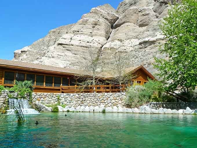 That emerald water against towering canyon walls looks like someone Photoshopped paradise into the desert.