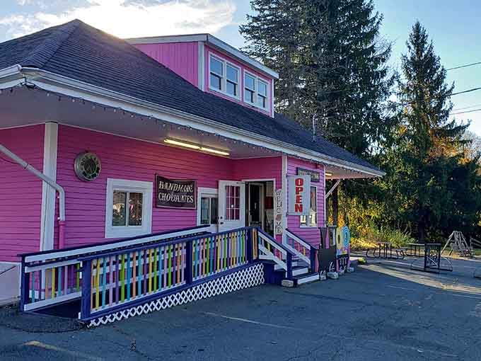 That hot pink exterior isn't whispering, it's shouting pure joy from every Victorian-era board and beam.