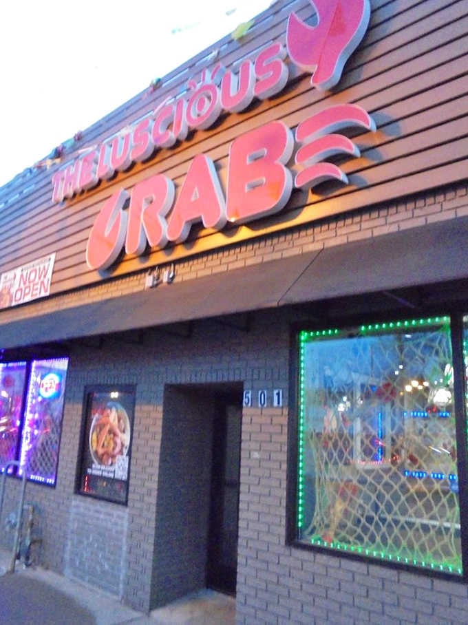That bold red crab logo isn't just decoration, it's a promise of the buttery chaos awaiting inside.