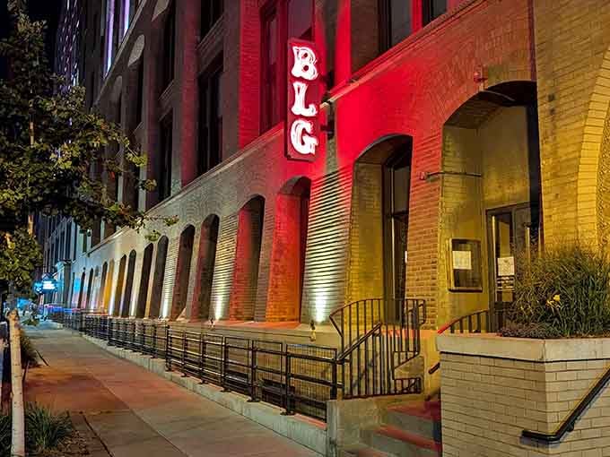 That illuminated facade isn't just showing off, it's announcing that something special awaits inside those arched doorways.