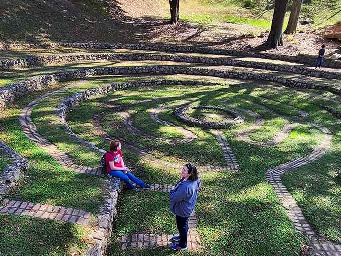 Two visitors pause mid-journey, discovering that the best conversations happen when you're walking in circles together.