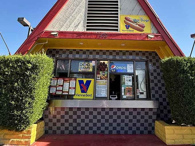 The checkered tile and cheerful signage create a welcoming entrance that promises good food and zero pretension inside.