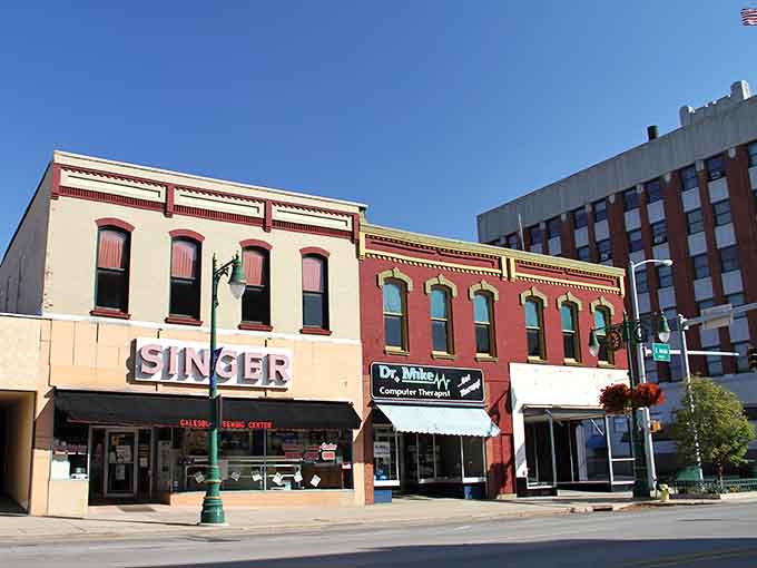 Downtown Galesburg's historic storefronts stand proud under blue skies, their ornate brickwork whispering tales from another century.