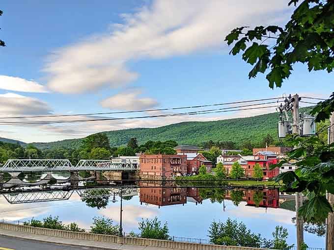 Fall foliage framing historic buildings and that iconic iron bridge, because New England knows how to show off.