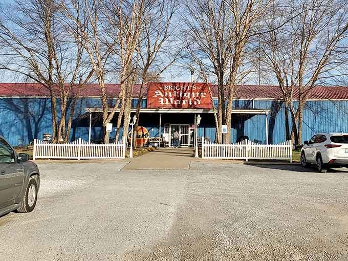 That cheerful blue warehouse holds more American history than most museums, and the parking lot's already whispering promises of treasure.