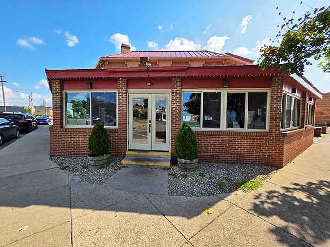 That brick exterior might look modest, but inside awaits barbecue magic that'll ruin you for lesser smoke shacks.
