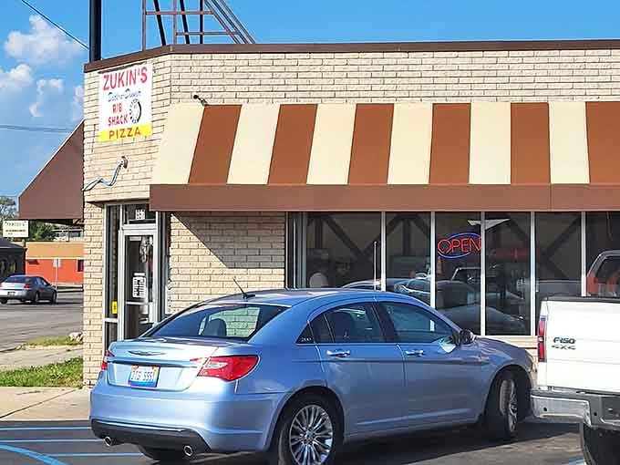 That striped awning and vintage sign tell you everything: this place has been perfecting comfort food since your bell-bottoms were cool.