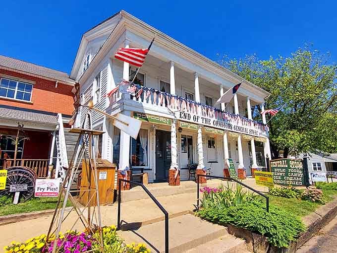 Bright blue skies frame white columns where American flags wave proudly over this two-century-old treasure.
