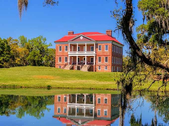 That red roof against blue sky and Spanish moss? Pure South Carolina magic in architectural form.