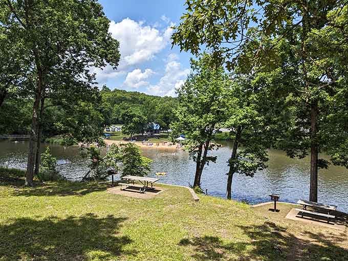 Shaded picnic areas overlook the calm waters, making them ideal spots for family gatherings and enjoying meals with beautiful scenery.