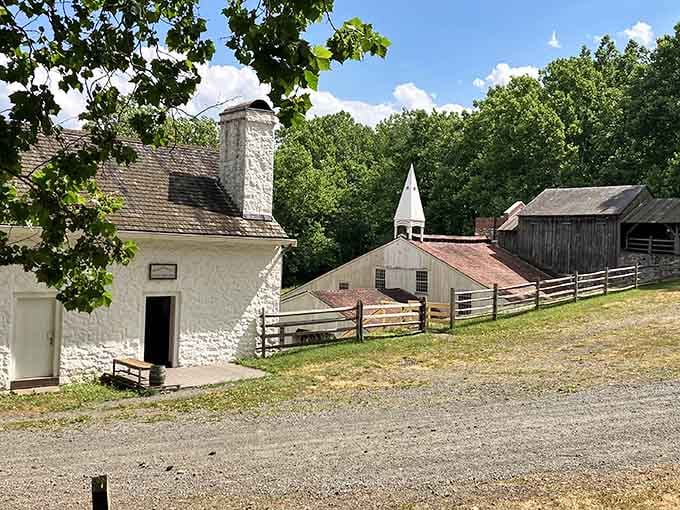 White-washed structures and red barns create a postcard-perfect scene that belies the site's gritty industrial heritage.