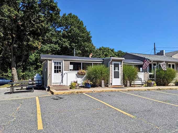That unassuming cottage-style building is your gateway to breakfast bliss, hiding in plain sight along Route 70.
