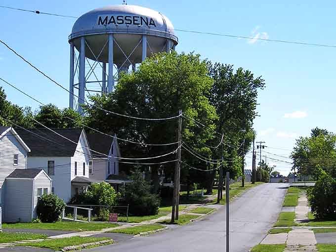 That water tower stands like a proud beacon over tree-lined streets where your retirement budget actually makes sense.