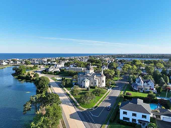 An aerial view showcasing Spring Lake's beautiful blend of pristine waterfront, elegant architecture, and lush greenery throughout this charming coastal town.