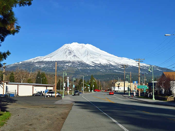 Mount Shasta towers over Main Street like nature's own skyscraper, reminding you why rent's still reasonable here.