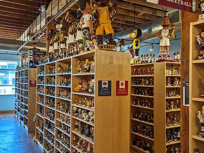 Rows of bobbling heads line the shelves like a who's who of pop culture history frozen in perpetual nodding agreement.