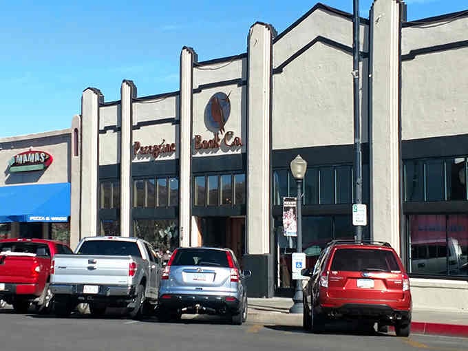 That charming storefront with the peregrine falcon logo isn't just inviting, it's practically begging you to come inside.