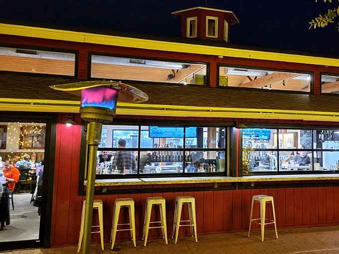 That red barn exterior glows like a beacon at night, promising craft beer and comfort food instead of livestock.