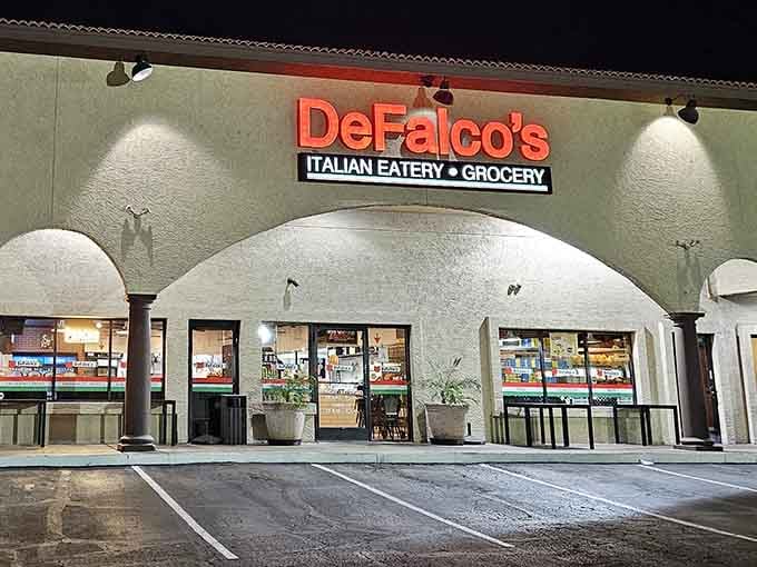Those arched entryways at night signal you're about to enter a place where serious sandwich magic happens daily.