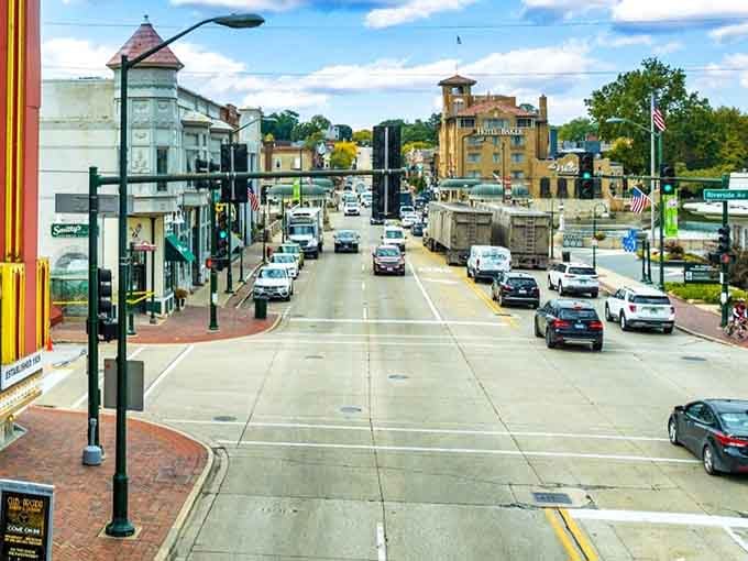 Main Street in St. Charles stretches toward the iconic Hotel Baker, showcasing the walkable downtown where locally-owned shops and restaurants await your exploration today.