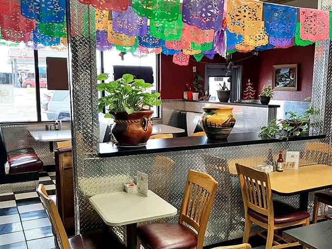 Festive papel picado banners and cozy booths create the perfect atmosphere for devouring authentic Mexican comfort food.