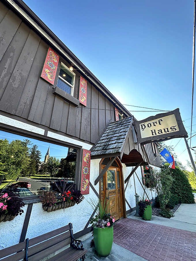 Those flower boxes and carved wooden doors promise the kind of meal where time slows down deliciously.