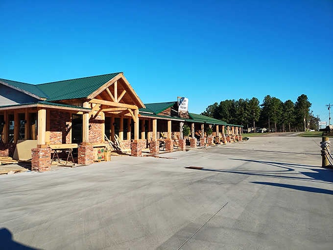 The covered walkway with brick columns welcomes you like a Southern front porch that stretches for days.